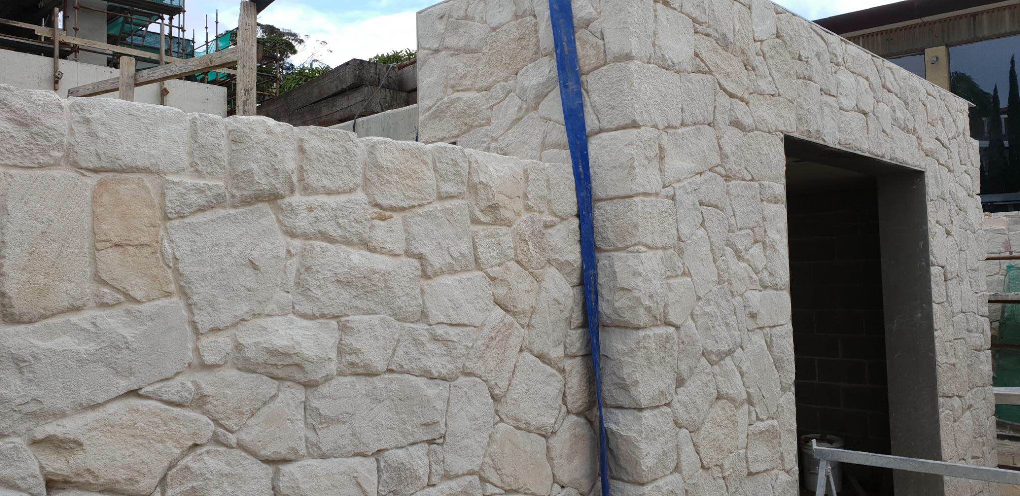 White sandstone cladding - Stone house build with local sandstone